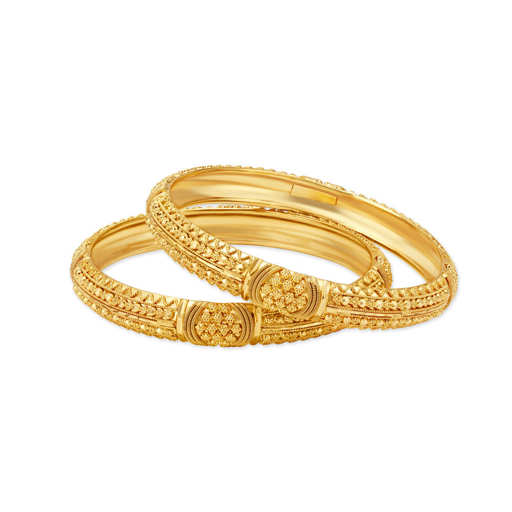Buy Elaborate Yellow Gold Carved Bangles at Best Price | Tanishq UAE