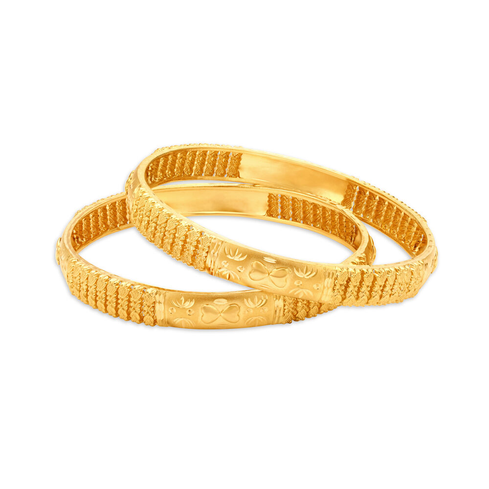 Buy Lustrous Yellow Gold Floral Carved Bangles at Best Price | Tanishq US